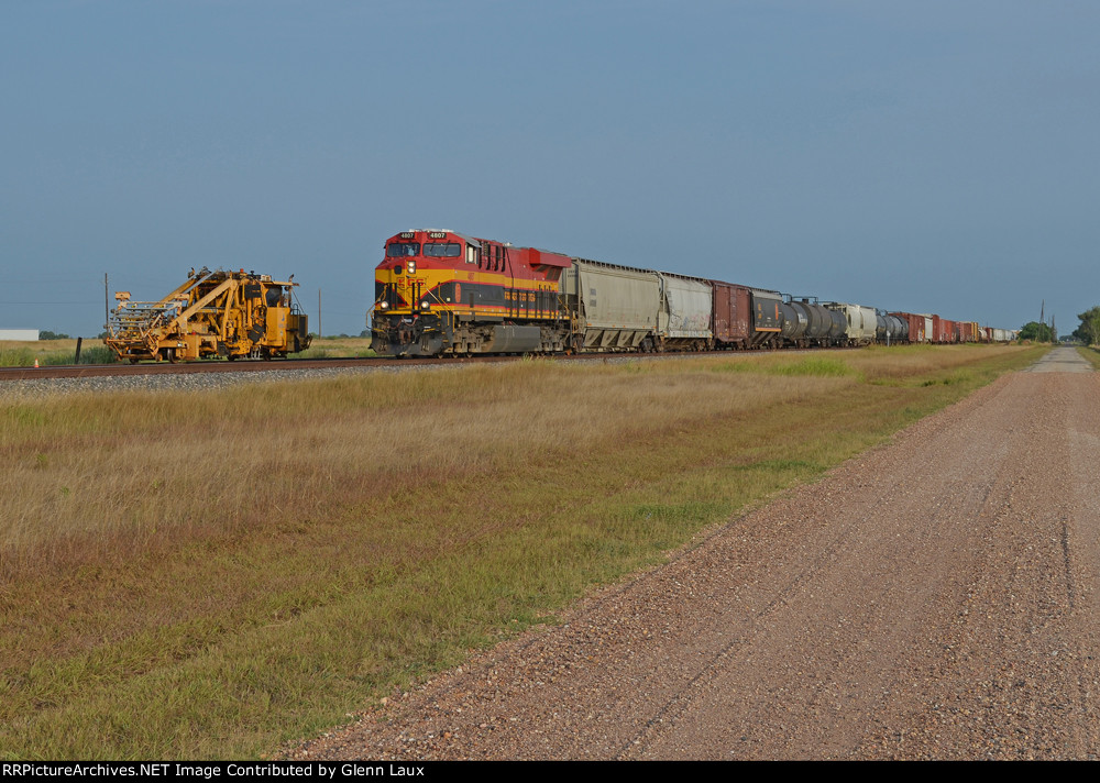 KCS 4807 leads a southbounder past a laser tamper